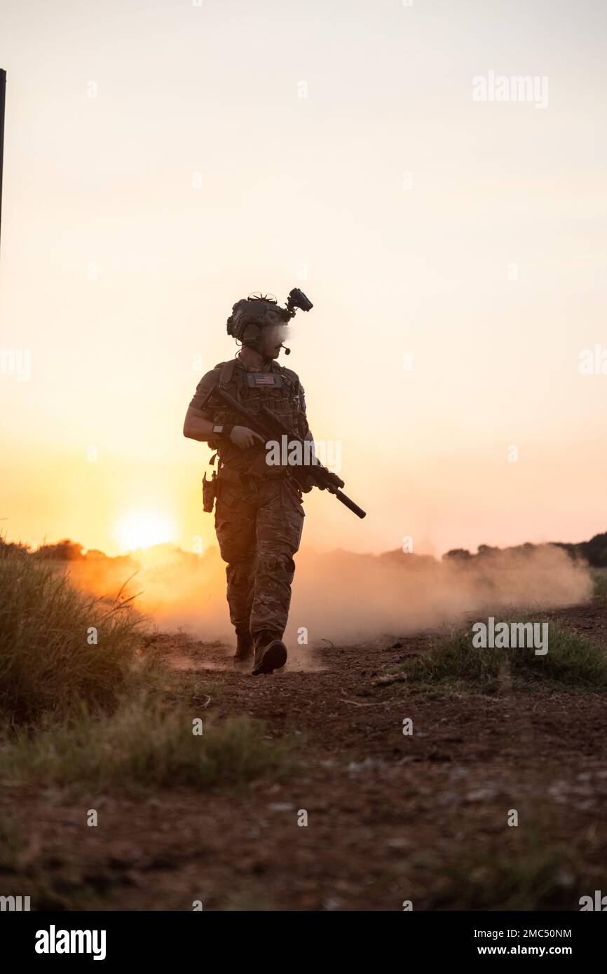 A critical skills operator patrols alongside explosive ordnance ...