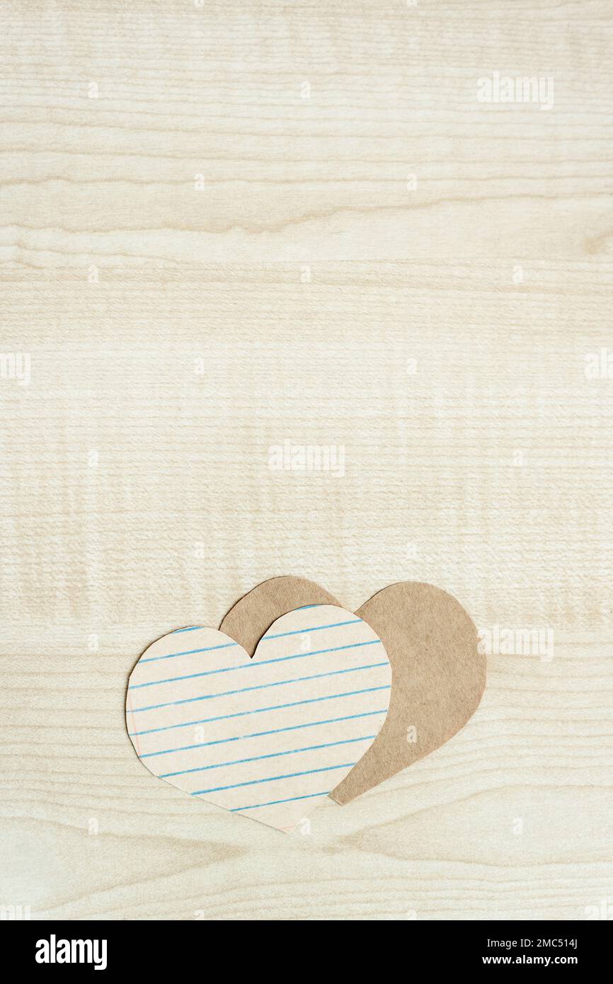 Two paper hearts on light wood background. Simple flatlay mockup Stock ...