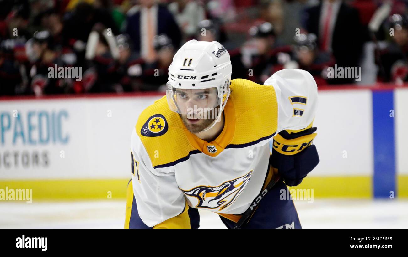 Nashville Predators center Luke Kunin (11) gets ready for a face-off ...