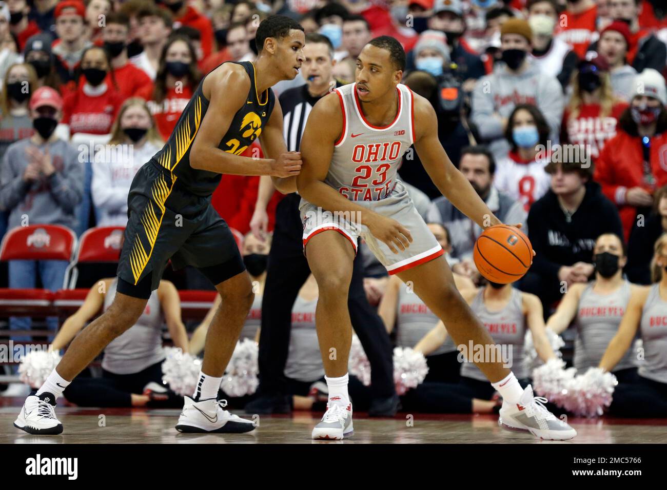Ohio State forward Zed Key, right, drives in front of Iowa forward Kris ...
