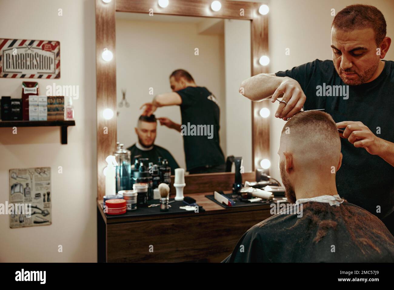Dnipro, Ukraine, October 7, 2022: hairdresser does hairstyle with ...