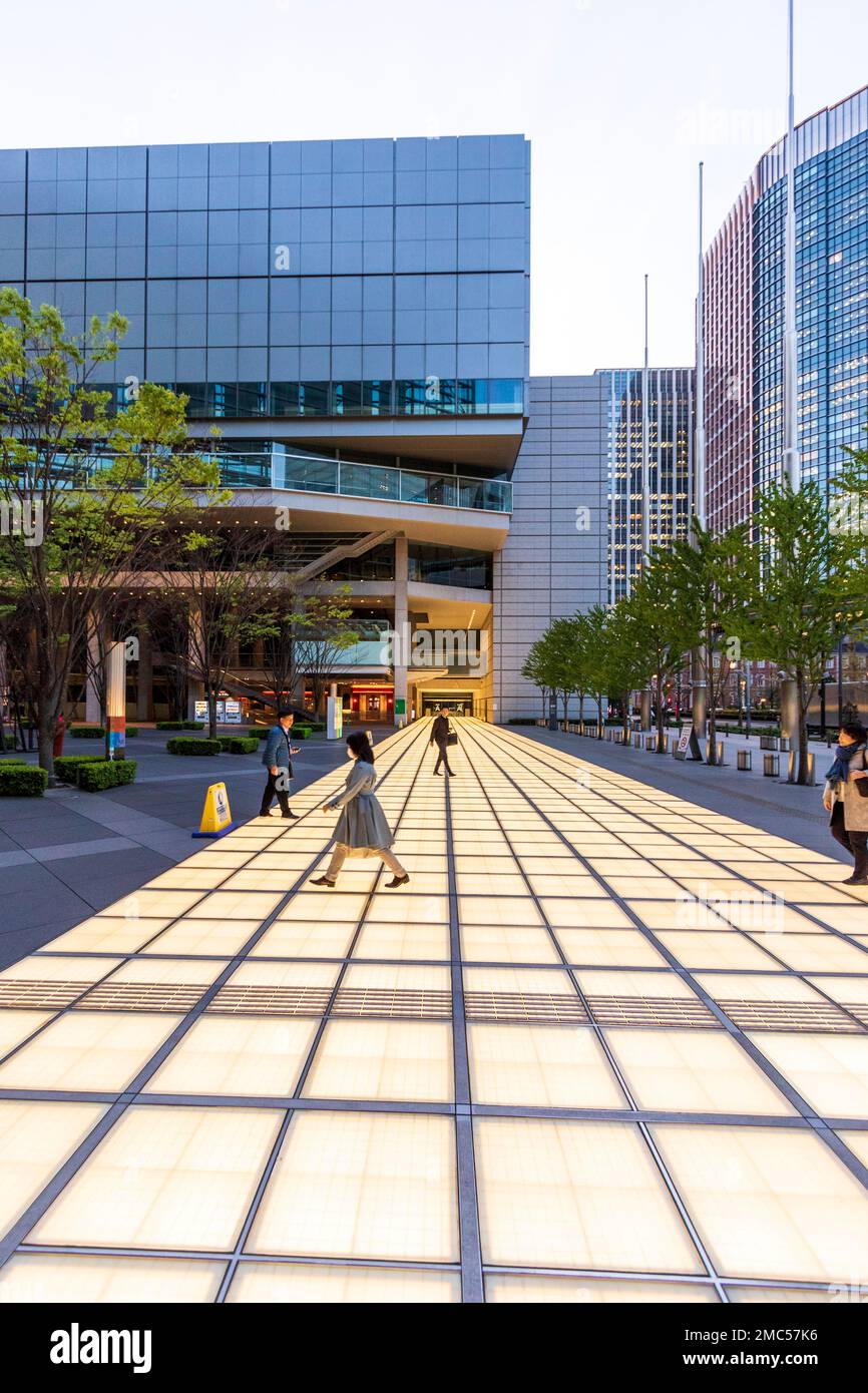 Illuminated pavement across a plaza leading from the Tokyo ...