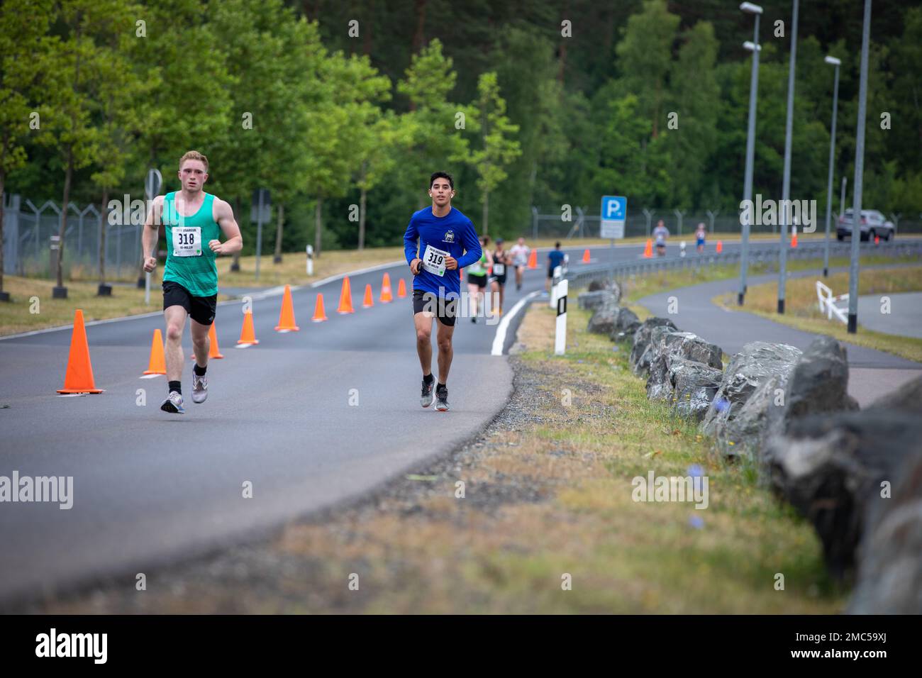 Peter Lafond and Josue Gutierrez run towards the finish line during the ...