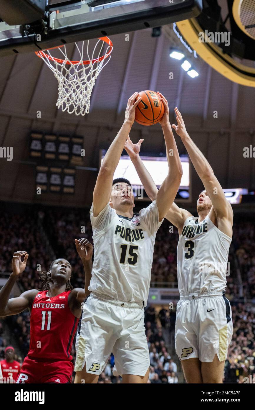 Purdue center Zach Edey (15) and forward Caleb Furst (3) go after a rebound during an NCAA ...