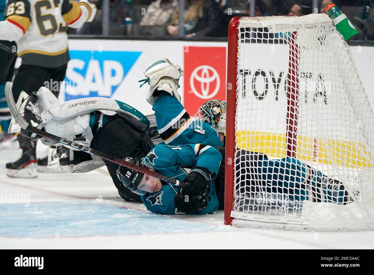 San Jose Sharks center Lane Pederson, foregound, and goaltender James ...
