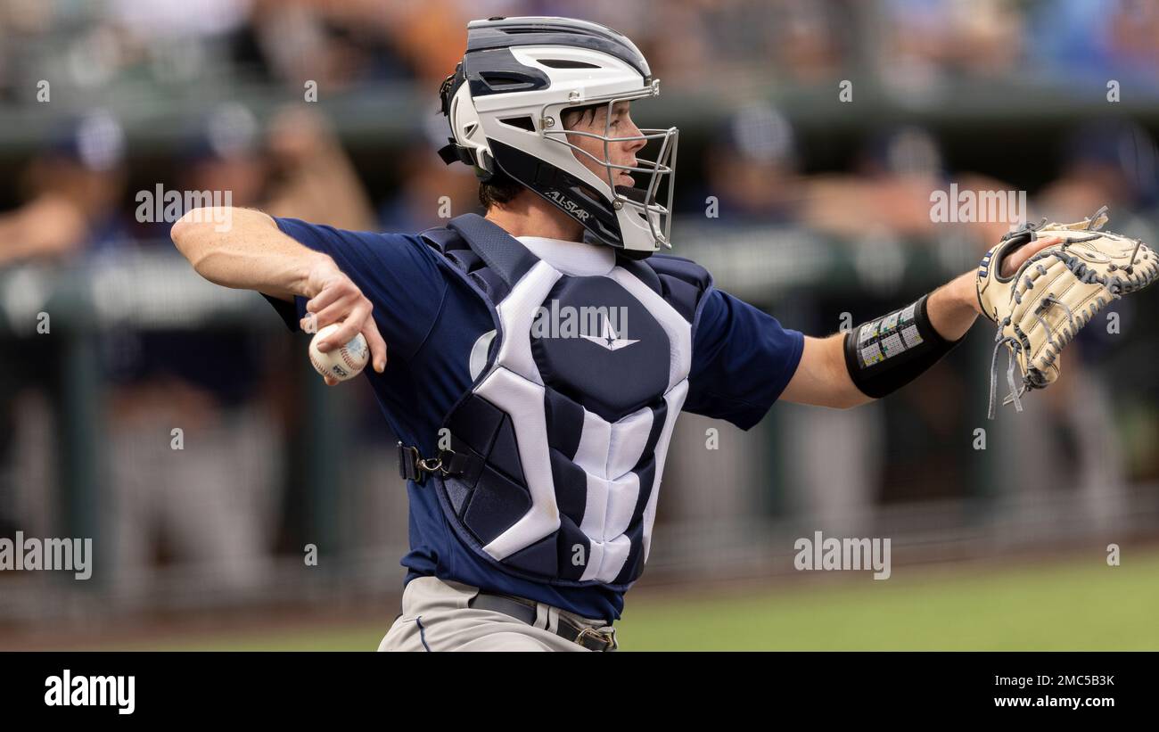 Rice catcher Justin Long (30) warms up between innings against Texas ...