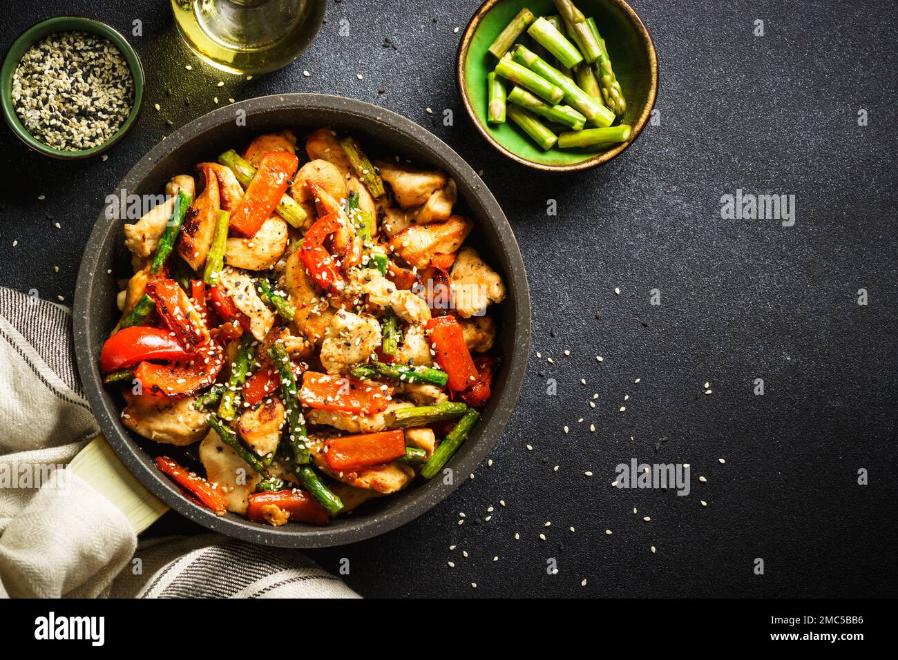 Chicken stir fry with vegetables at stone background Stock Photo - Alamy