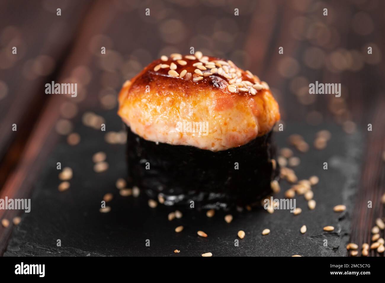 Baked shrimp gunkan on wooden background. Simple gunkan sushi with ...