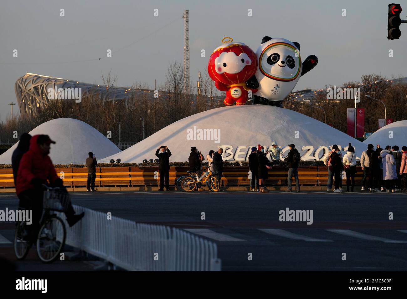 Residents gather to take souvenir pictures with the mascots for the ...
