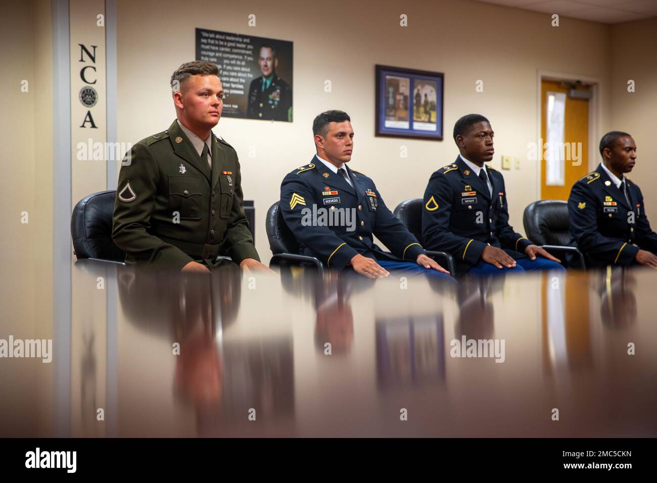 Soldiers with the 13th Expeditionary Sustainment Command sit at the ...