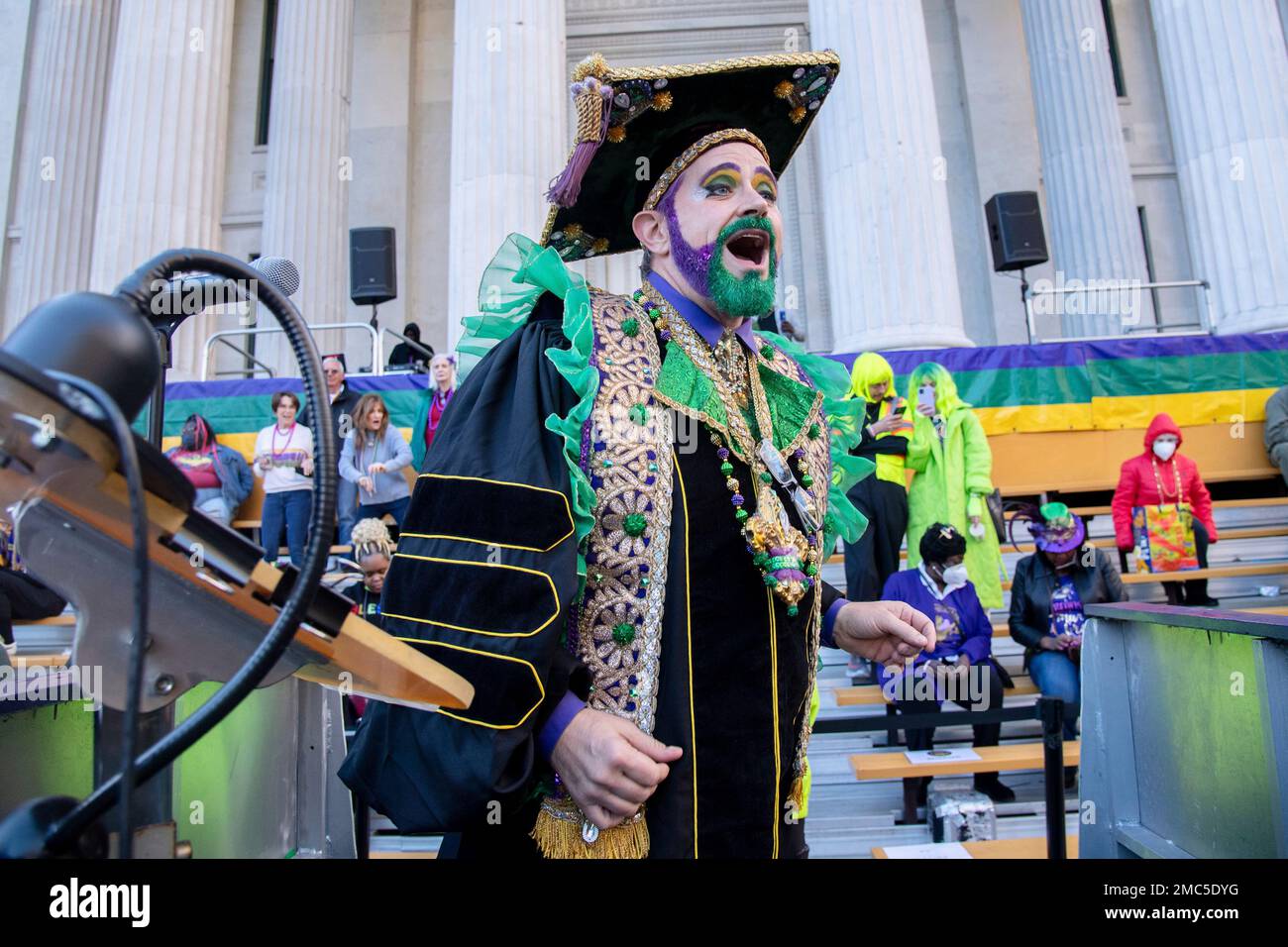A reveler is seen on the steps of Gallier Hall as the Krewe of Freret ...