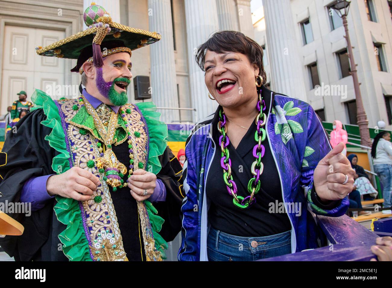 A reveler, left, and New Orleans Mayor LaToya Cantrell are seen on the ...