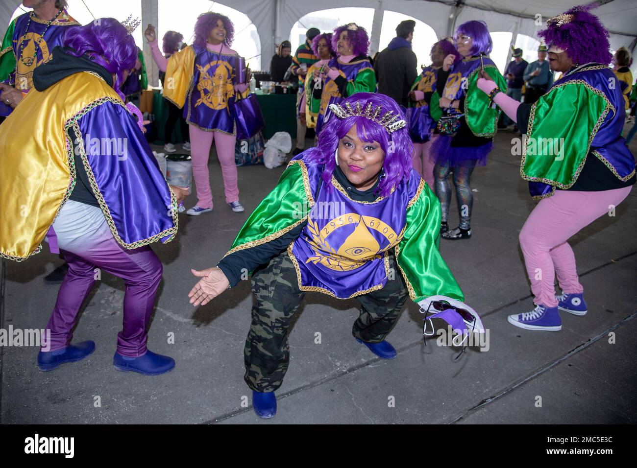 Krewe of Freret members dance at a pre-parade party at Mardi Gras World ...