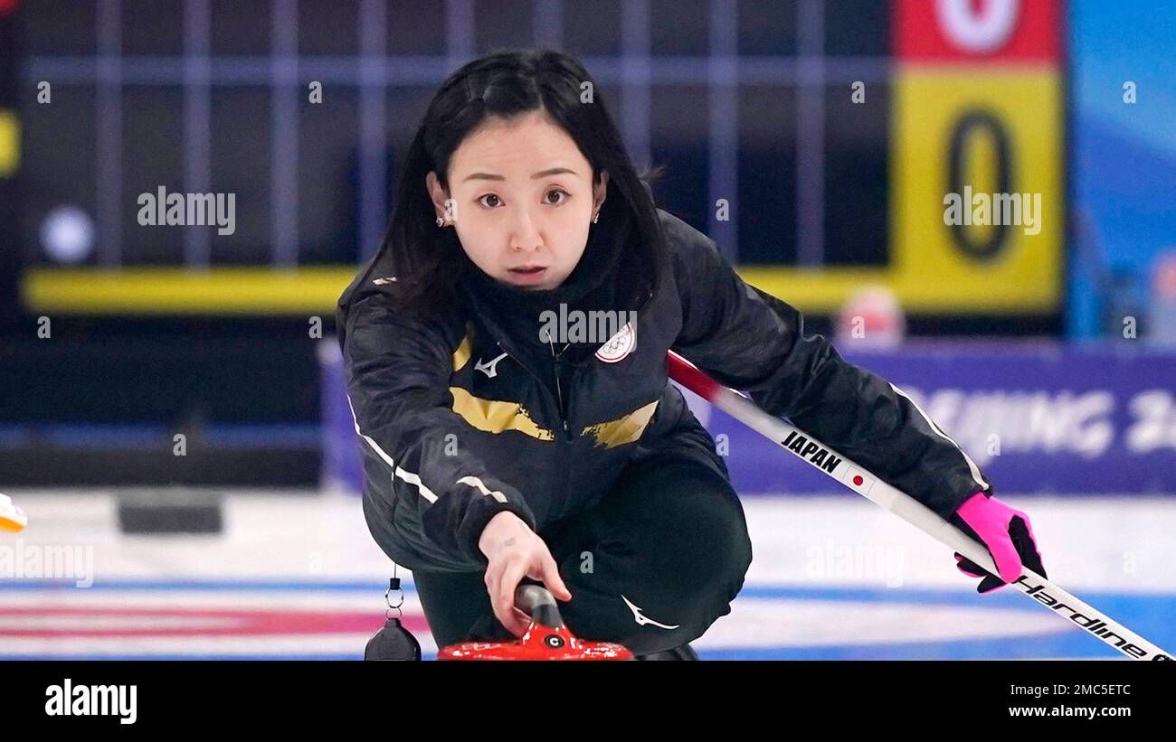 Japan's Satsuki Fujisawa throws a rock during the women's curling final ...