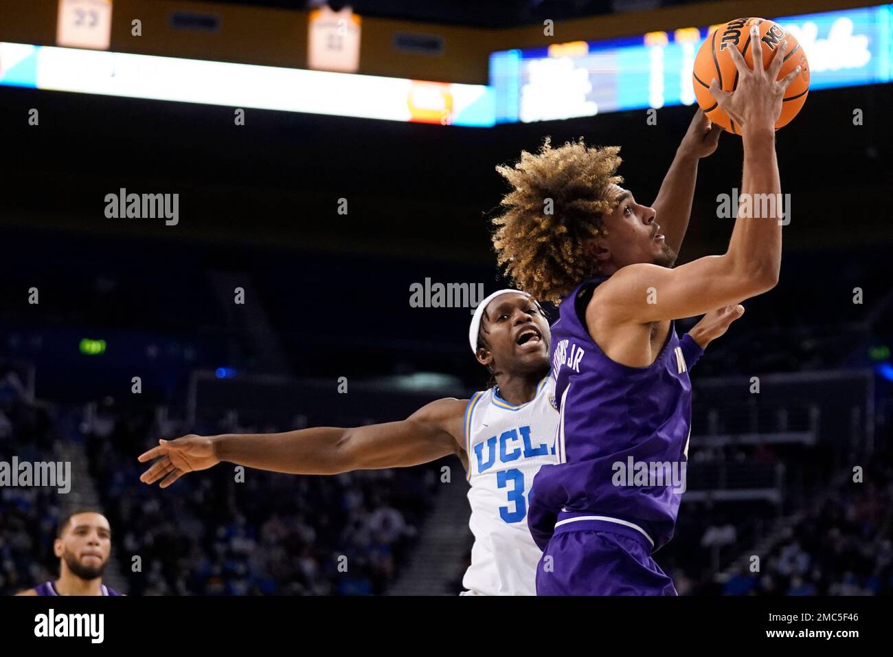 Washington forward Emmitt Matthews Jr., right, grabs a rebound next to ...