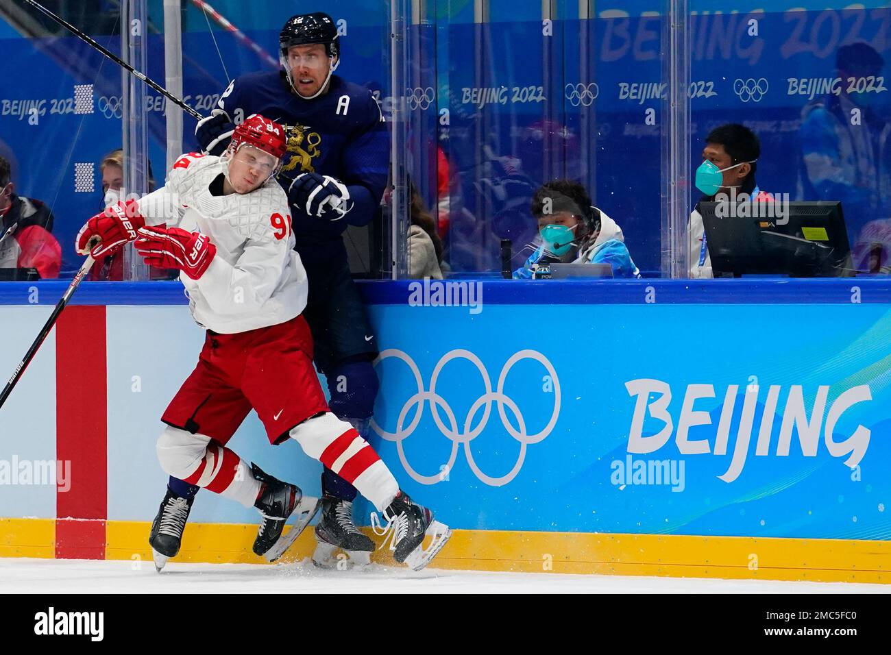 Russian Olympic Committee's Kirill Semyonov (94) checks Finland's Marko ...