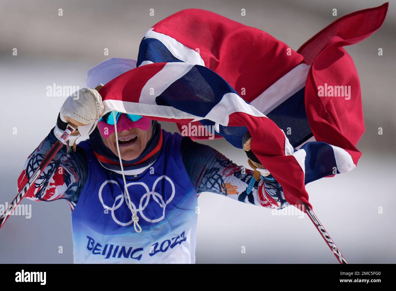 Norway's Therese Johaug celebrates after crossing the finish line ...