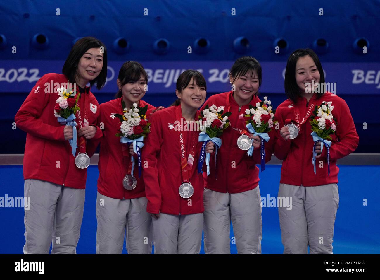 Silver medalists Team Japan celebrate during a medal ceremony for the ...
