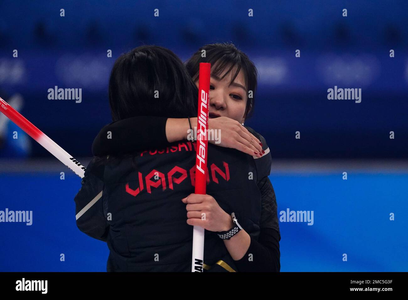 Japan's Chinami Yoshida, facing camera, and Satsuki Fujisawa hug after ...