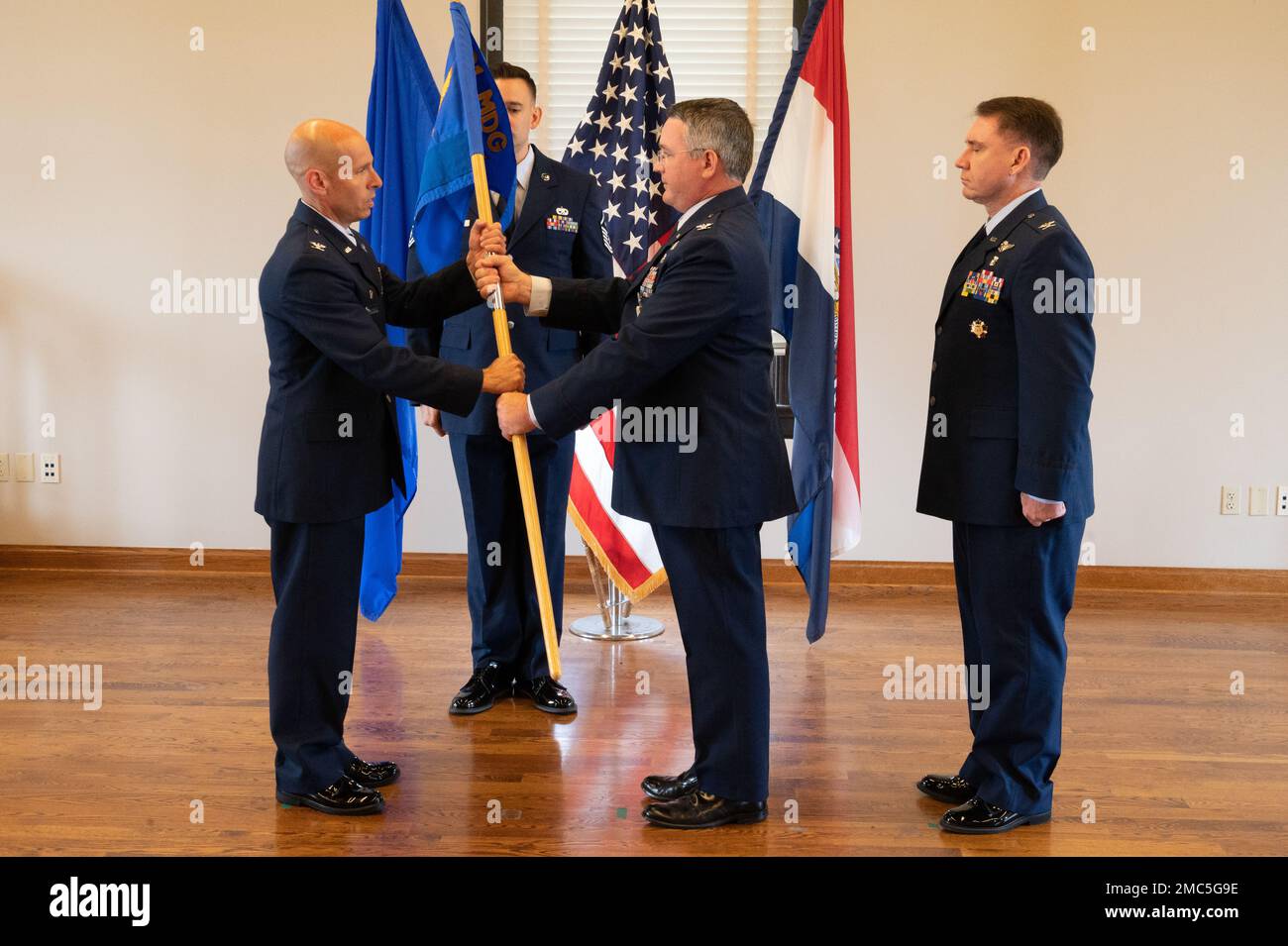 Col. Matthew Calhoun, commander, 131st Bomb Wing, receives the group’s ...