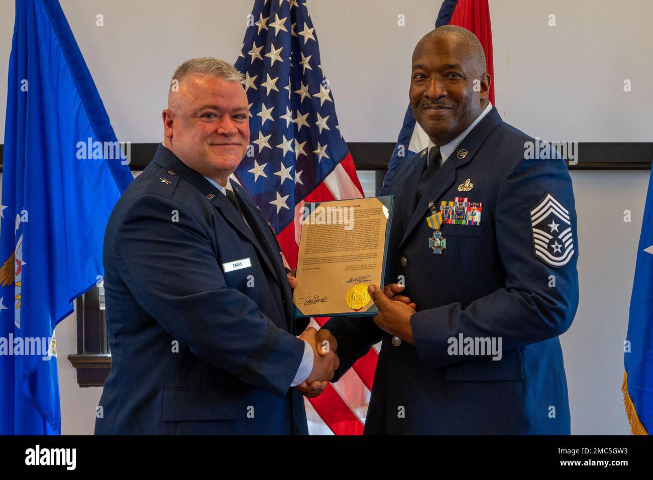 Chief Master Sgt. LeRoy E. McCardell Jr., right, 131st Bomb Wing command chief master sergeant ...