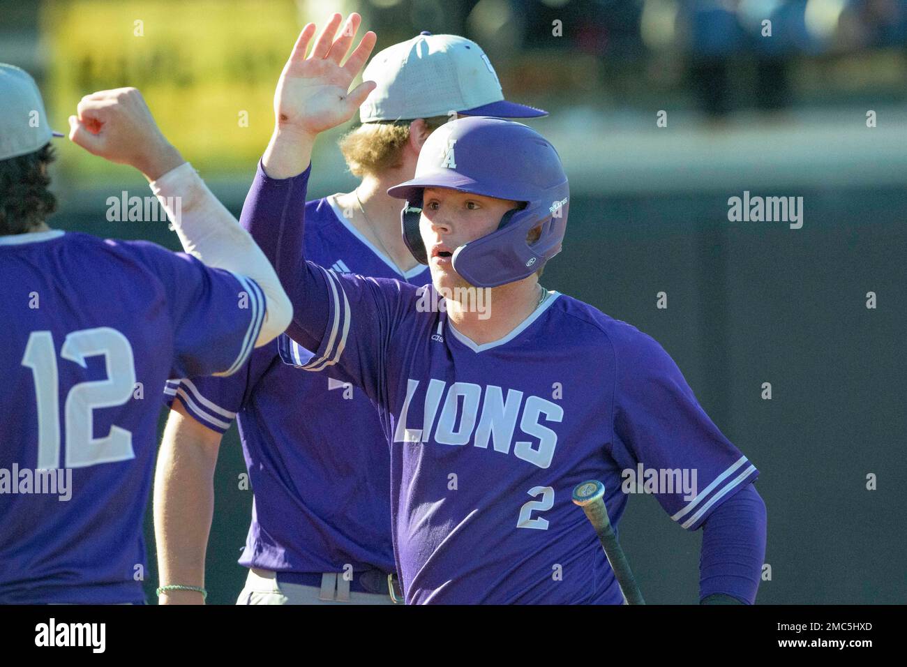 North Alabama shortstop Drew Hudson (2) celebrates a run scored with ...
