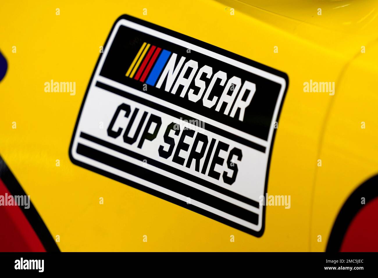 A NASCAR logo sticker is seen on a car during auto race practice at ...