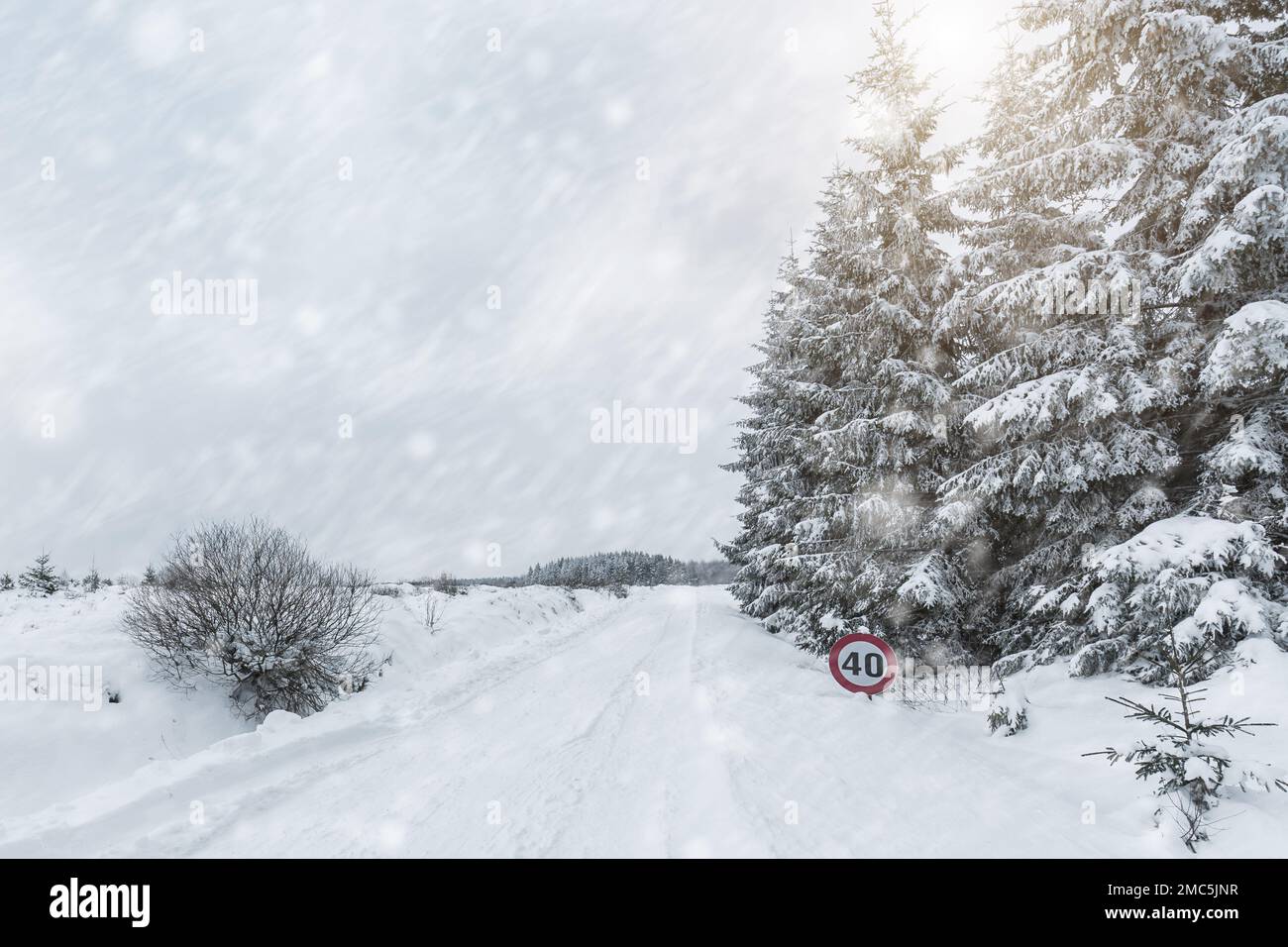 Winter Road covered in snow Stock Photo - Alamy