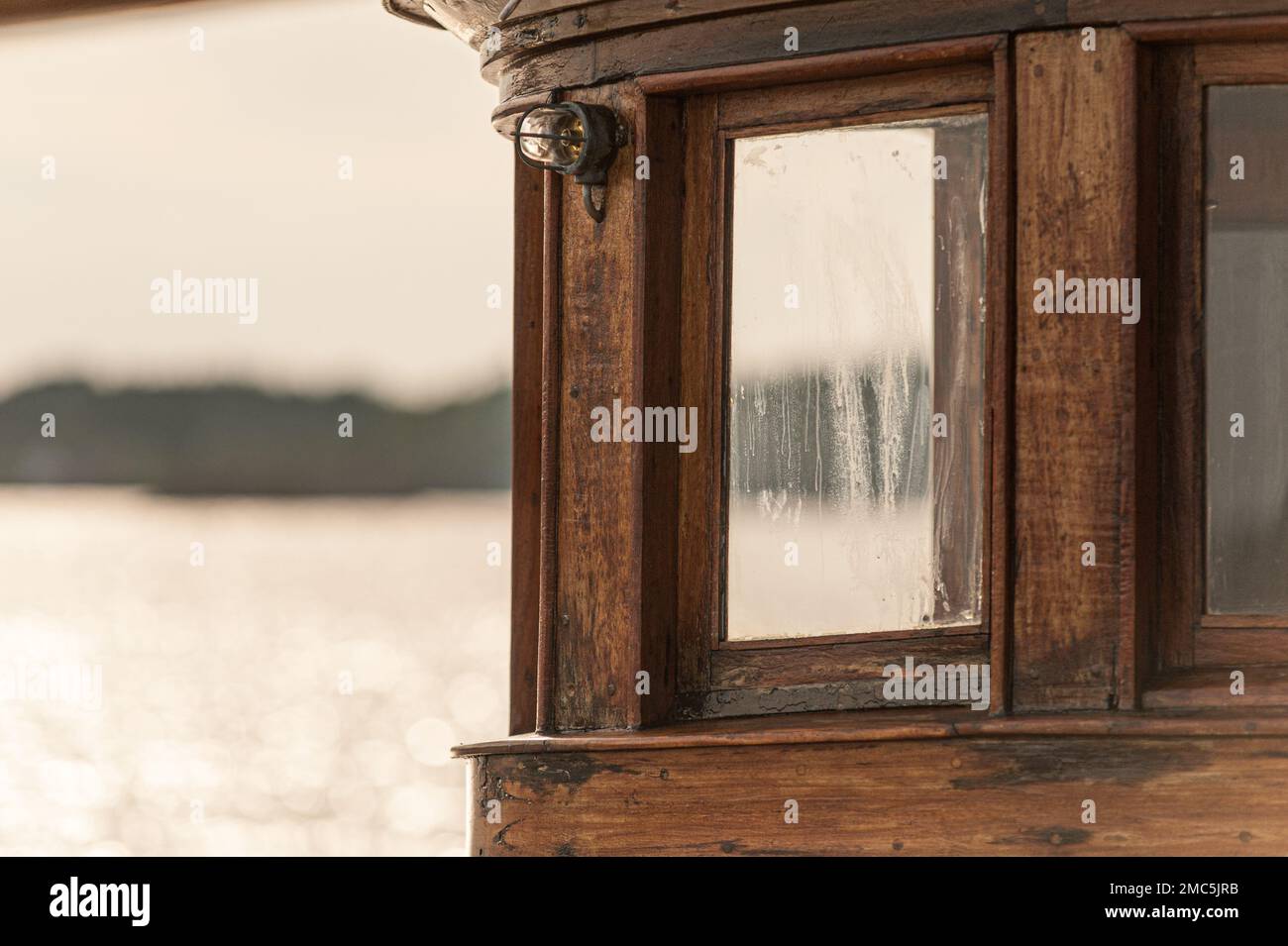 Windows of a wheelhouse of a wooden boat Stock Photo - Alamy