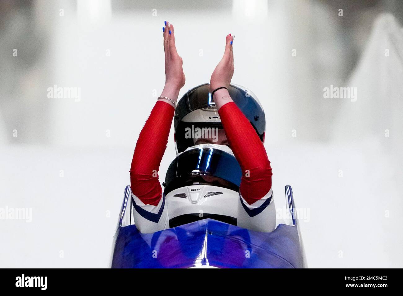 Margot Boch and Carla Senechal, of France, celebrate in the finish area ...