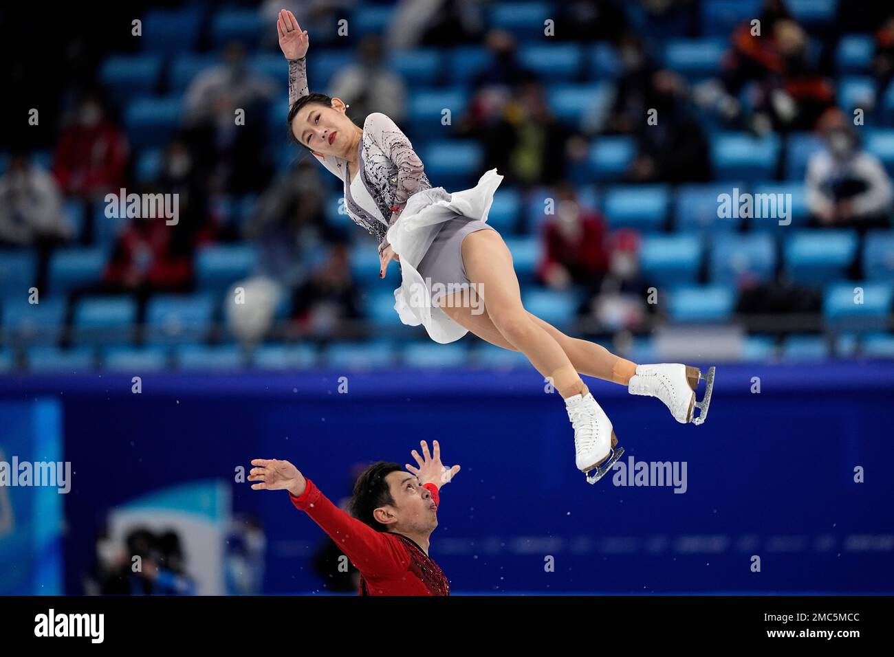 Peng Cheng and Jin Yang, of China, compete in the pairs free skate ...