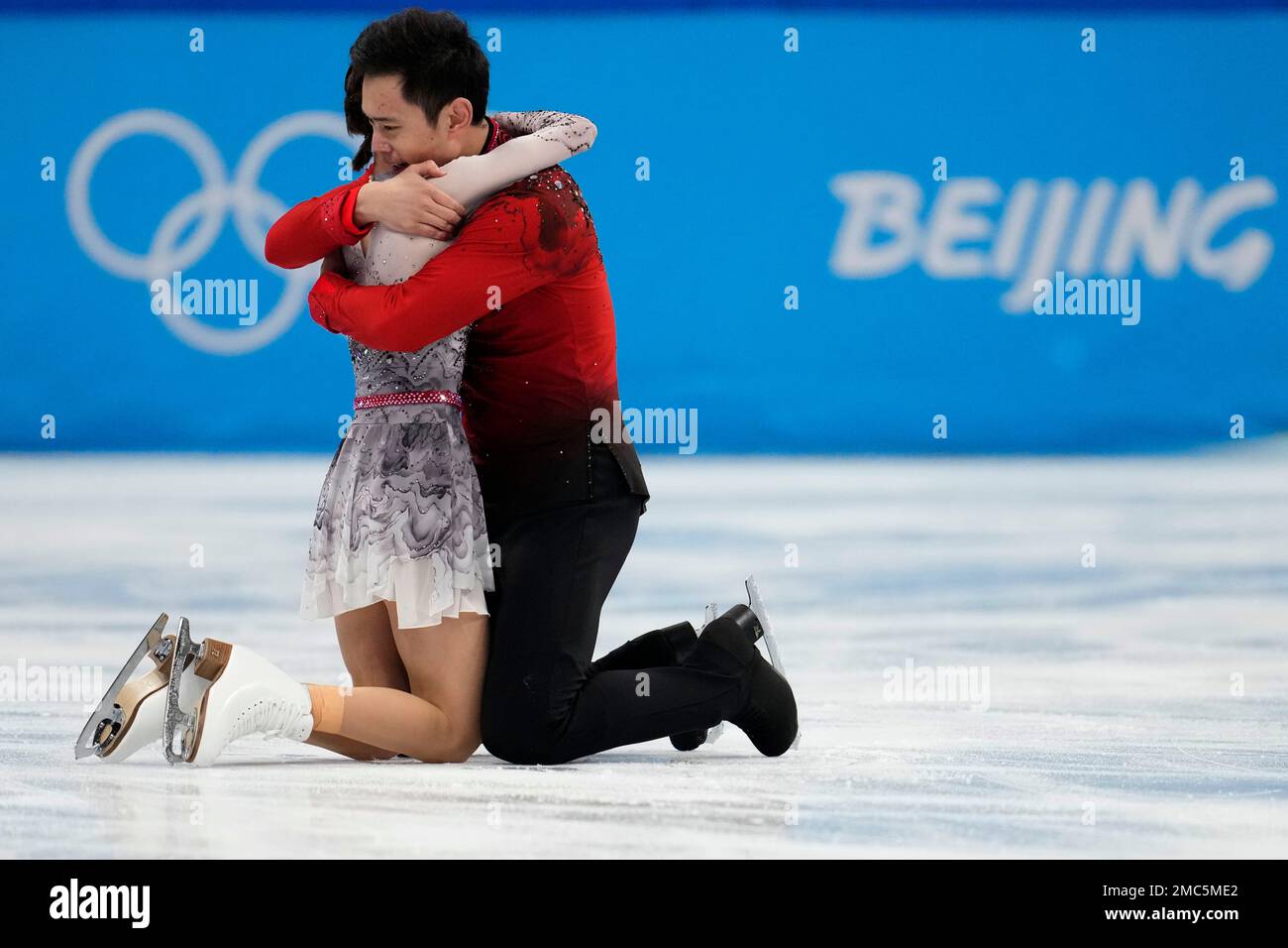 Peng Cheng and Jin Yang, of China, compete in the pairs free skate ...