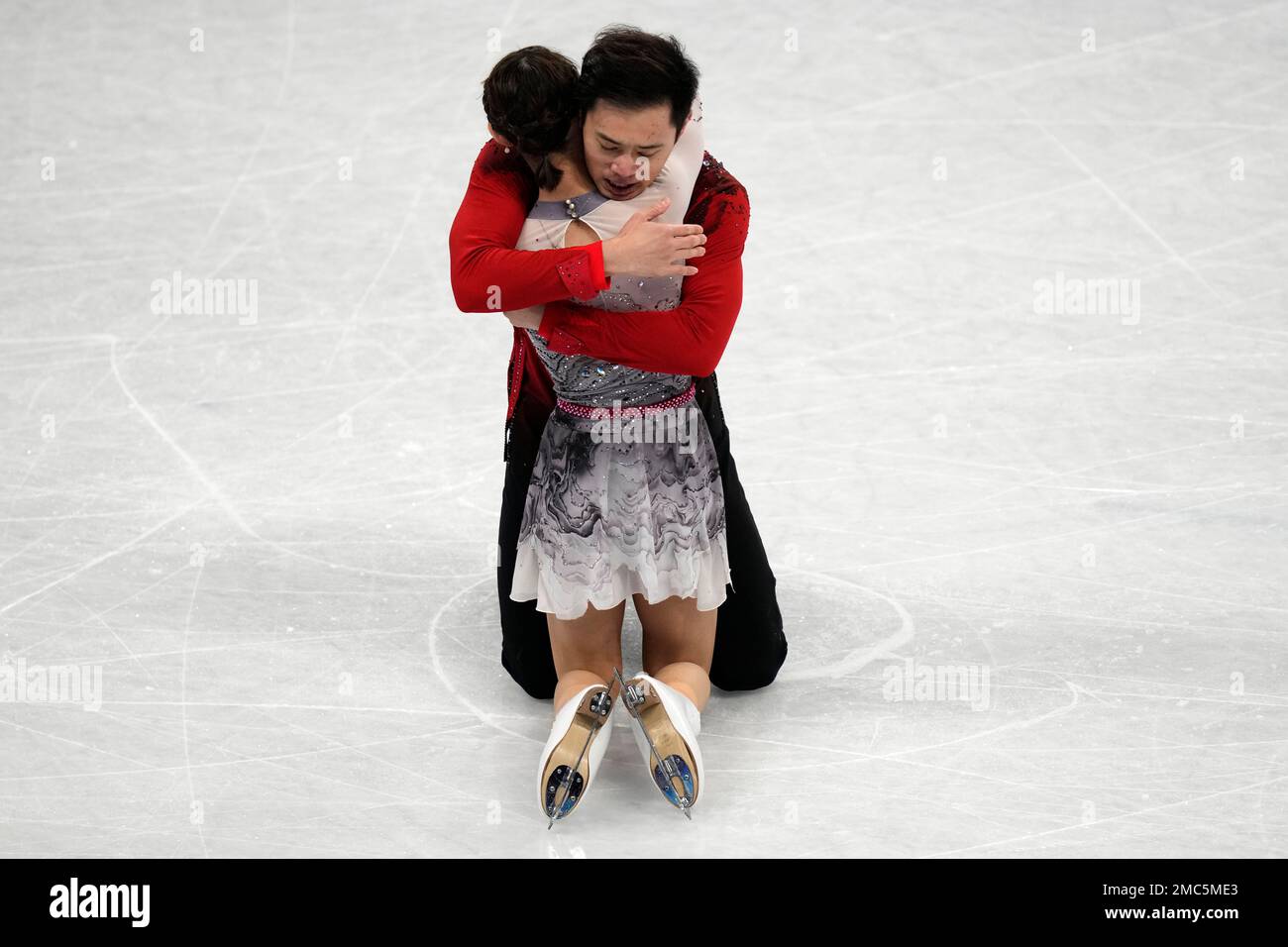 Peng Cheng and Jin Yang, of China, compete in the pairs free skate ...