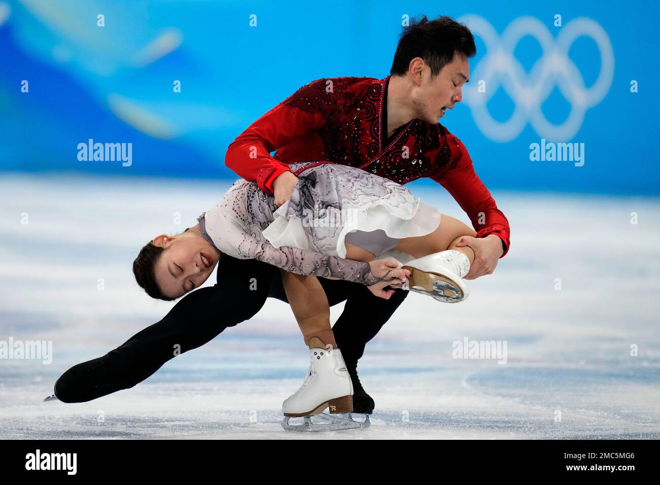 Peng Cheng and Jin Yang, of China, compete in the pairs free skate ...