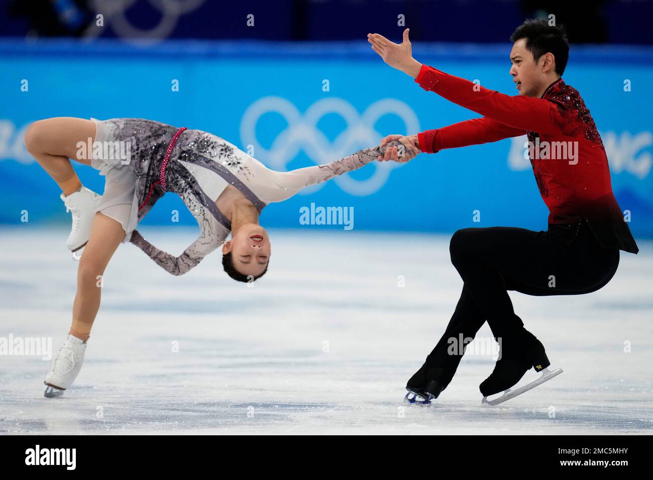 Peng Cheng and Jin Yang, of China, compete in the pairs free skate ...