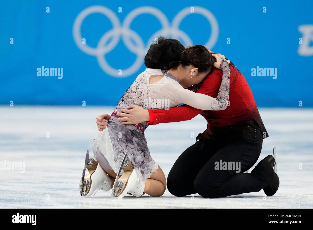 Peng Cheng and Jin Yang, of China, compete in the pairs free skate ...