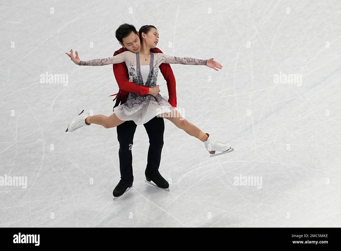 Peng Cheng and Jin Yang, of China, compete in the pairs free skate ...