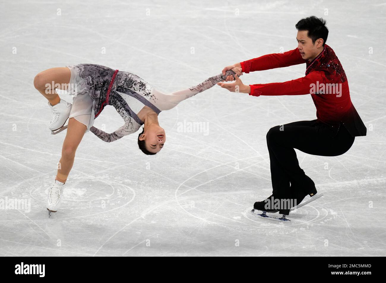 Peng Cheng and Jin Yang, of China, compete in the pairs free skate ...