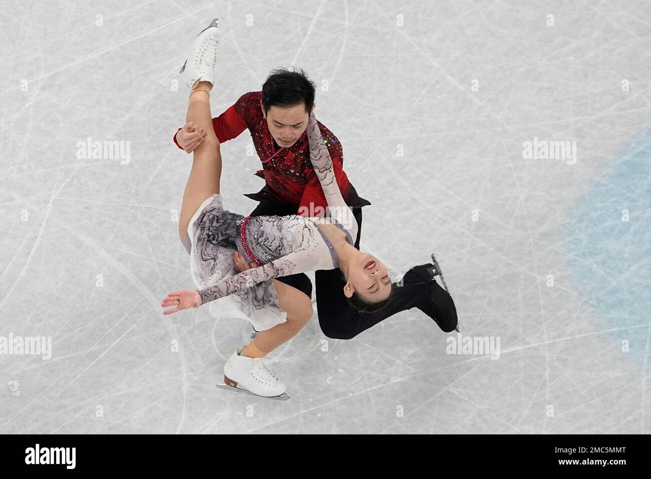 Peng Cheng and Jin Yang, of China, compete in the pairs free skate ...