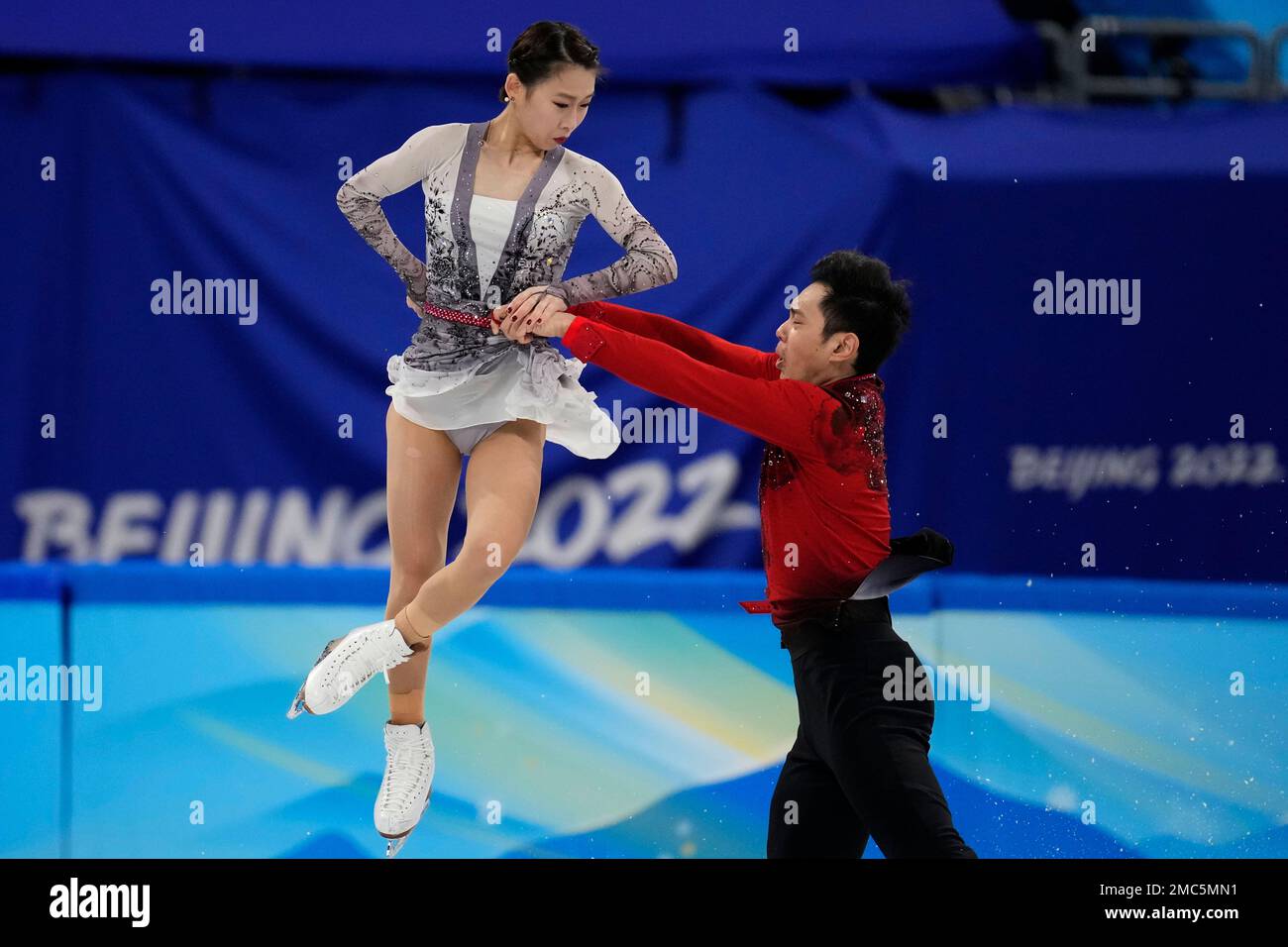 Peng Cheng and Jin Yang, of China, compete in the pairs free skate ...