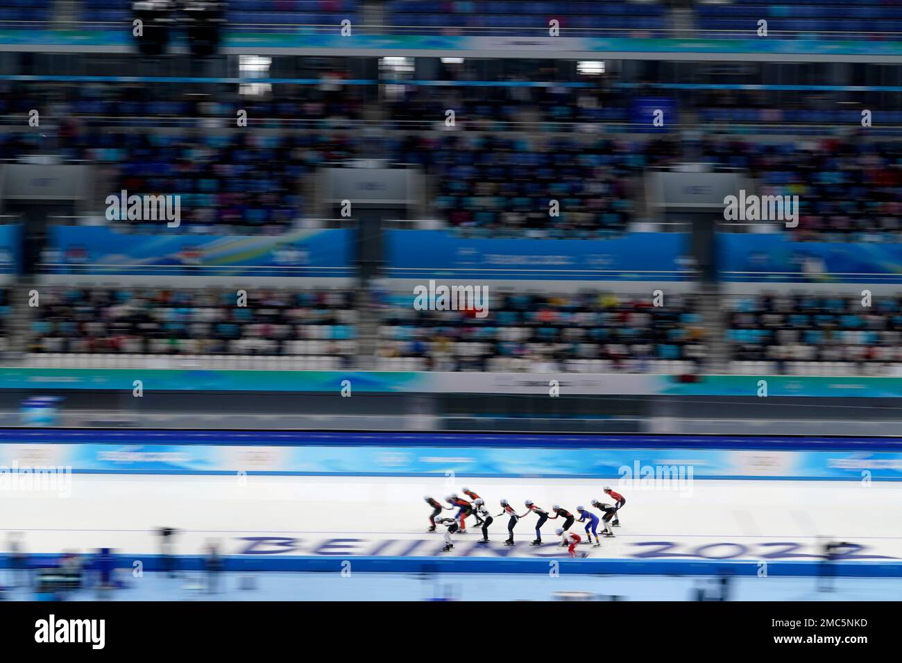Athletes compete during the women's speedskating mass start semifinals ...