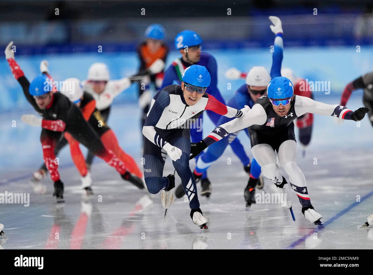 Athletes compete during the men's speedskating mass start finals at the ...
