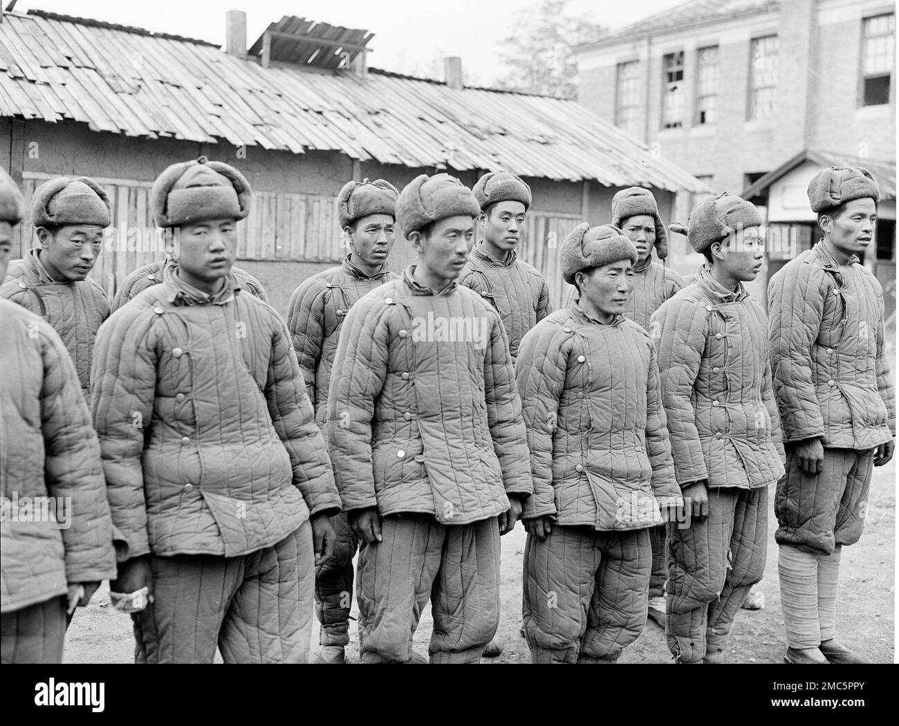 FILE - Chinese Communist troops wearing Manchurian winter gear line up ...