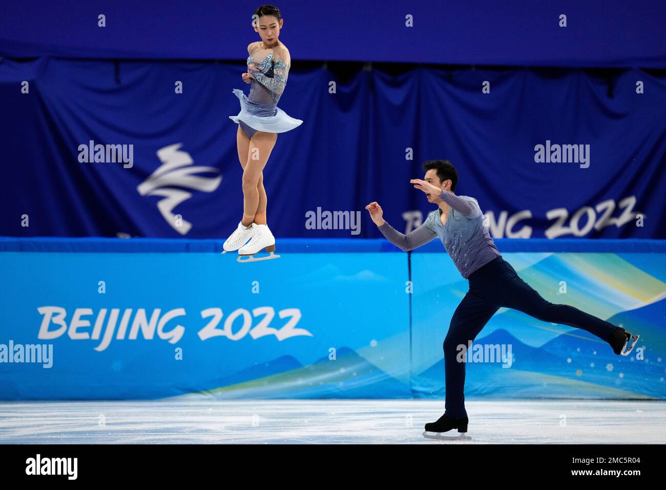 Peng Cheng and Jin Yang, of China, compete in the pairs short program ...