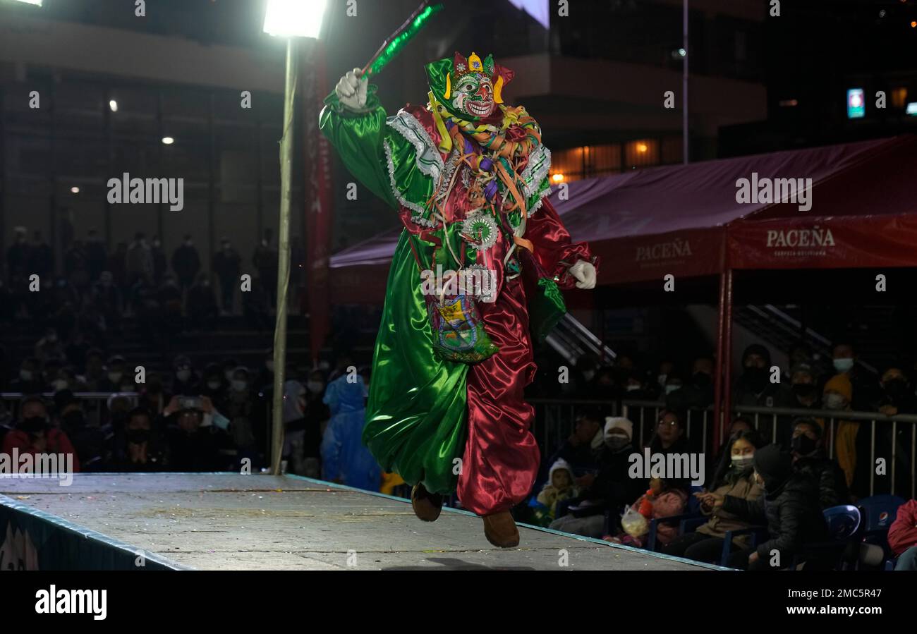 A contestant dressed as the Carnival character Pepino shows off his ...
