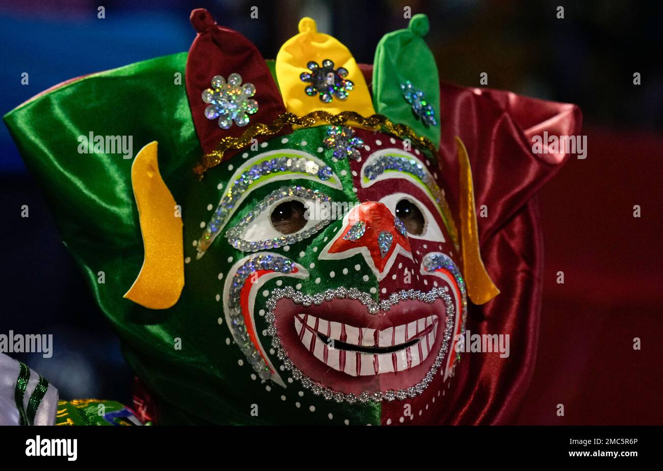 A contestant dressed as the Carnival character Pepino shows off his ...