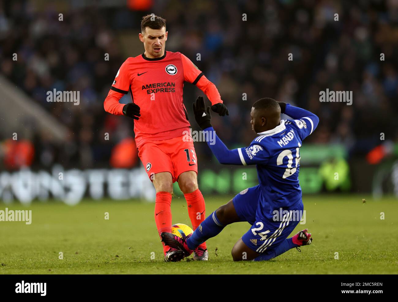 Leicester, England, 21st January 2023. Pascal Gross of Brighton tackled by Nampalys Mendy of ...