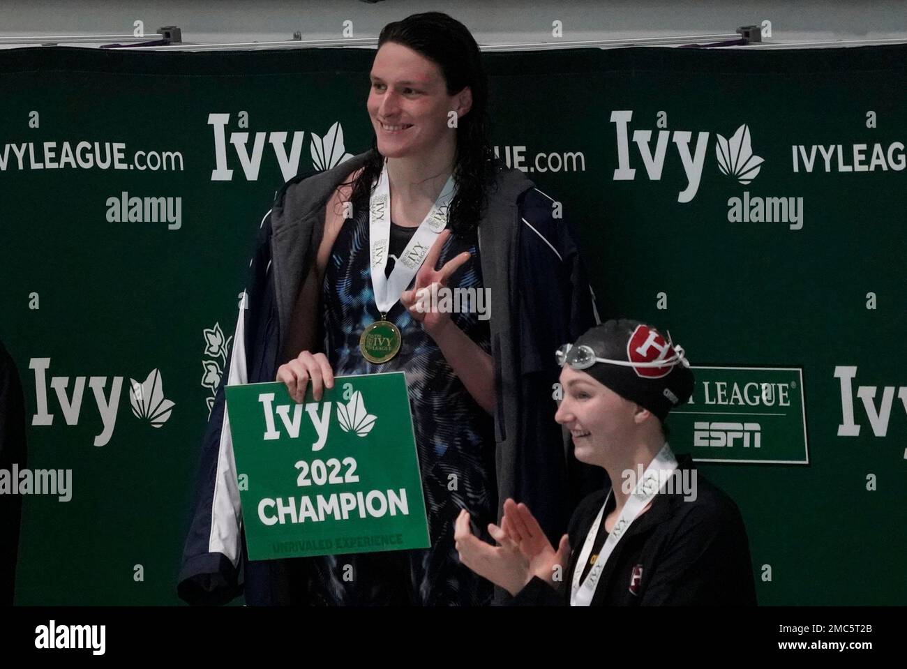 Pennsylvania's Lia Thomas, top, celebrates with the first-place medal ...