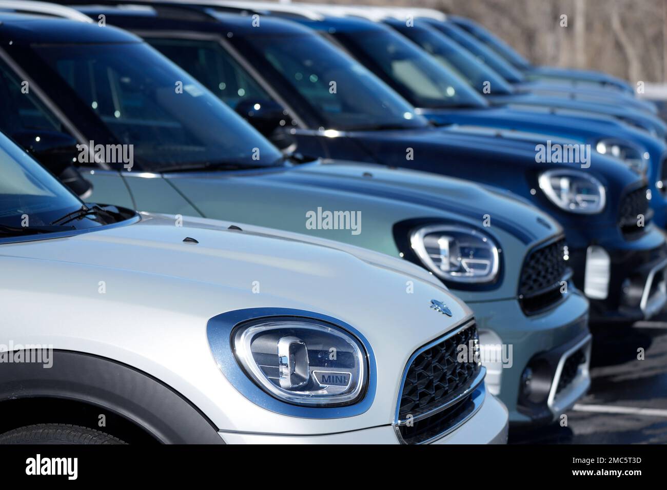 In this Friday, Feb. 18, 2022, photograph, a line of unsold 2022 ...