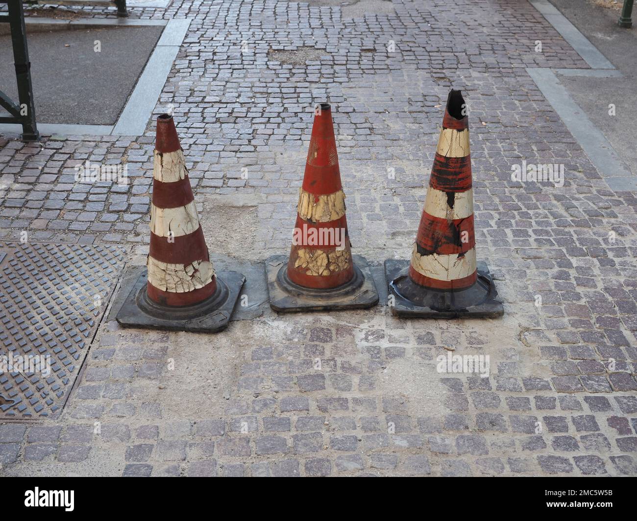 three traffic cones to mark road works or temporary obstruction traffic ...